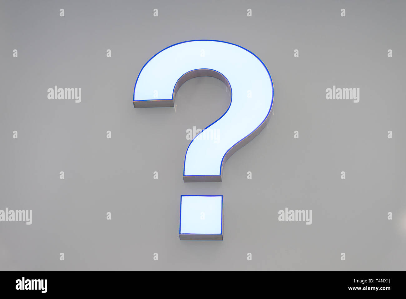 Illuminated LED question sign hanging on wall Stock Photo - Alamy