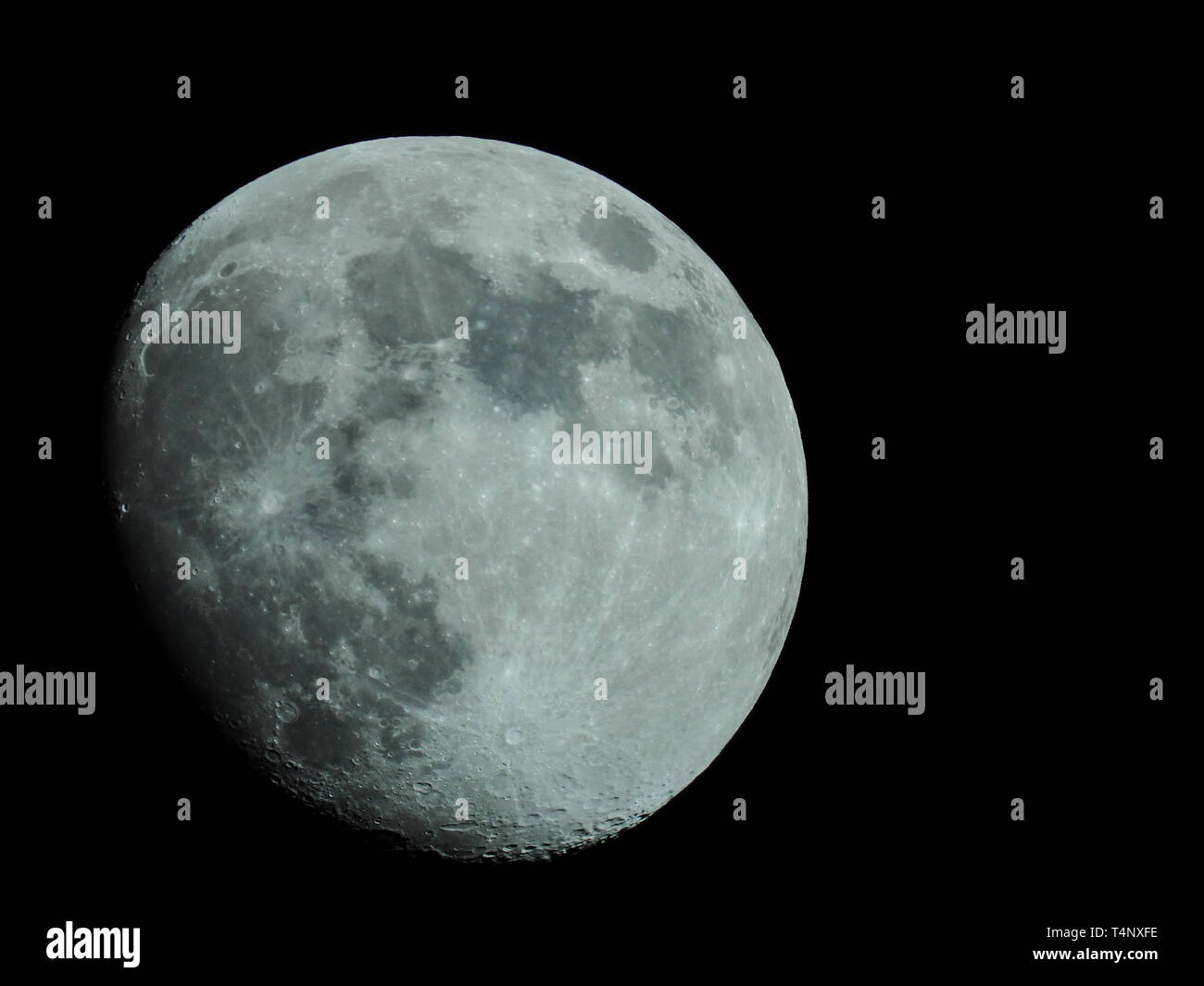 almost full moon in the night sky Stock Photo - Alamy