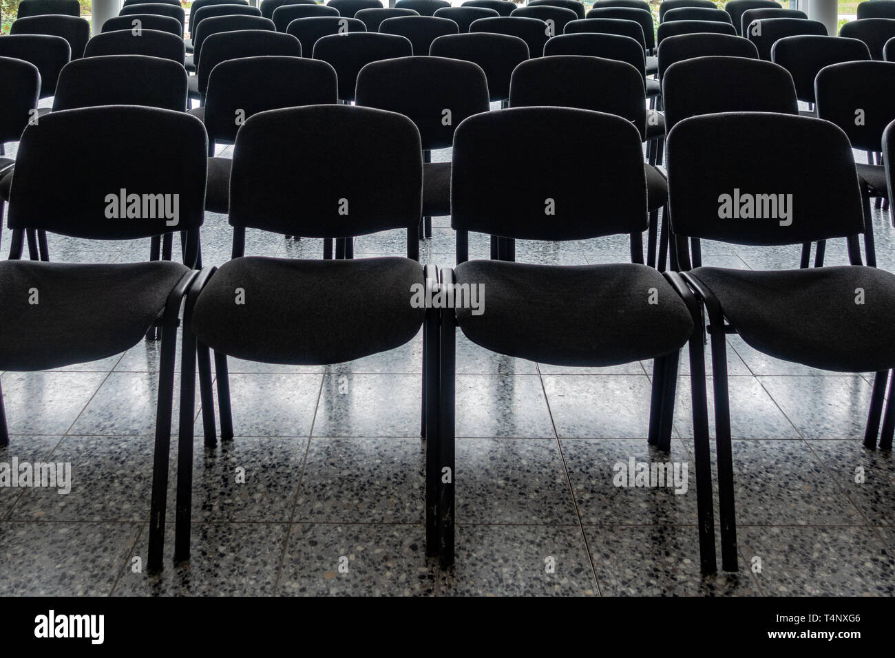 empty chairs in the foyer of a hall Stock Photo - Alamy