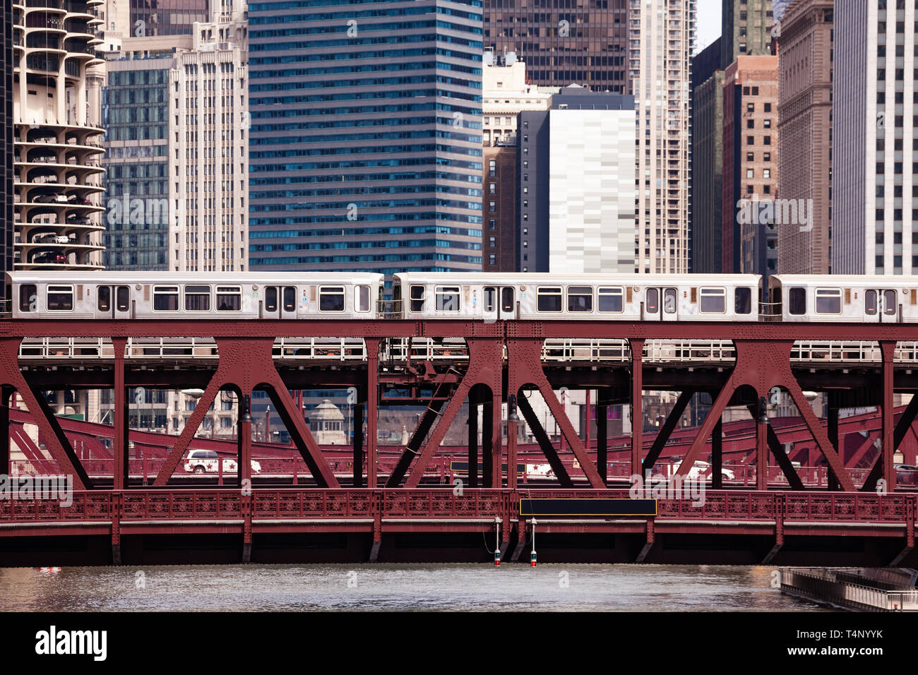 Trains running on the metal bridge over river in City of Chicago ...