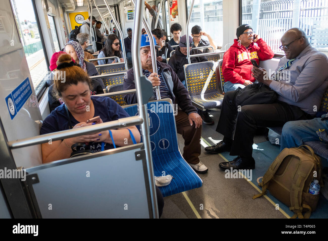Riders on the Expo Line, Los Angeles Metro public transportation, Los ...