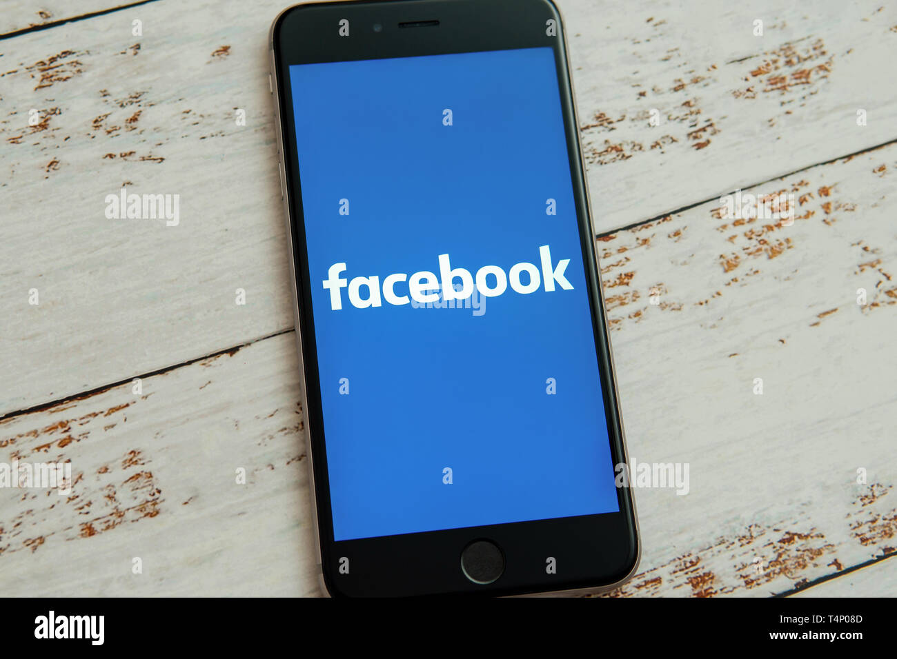 Black iPhone with logo of social media Facebook on the screen. Social ...