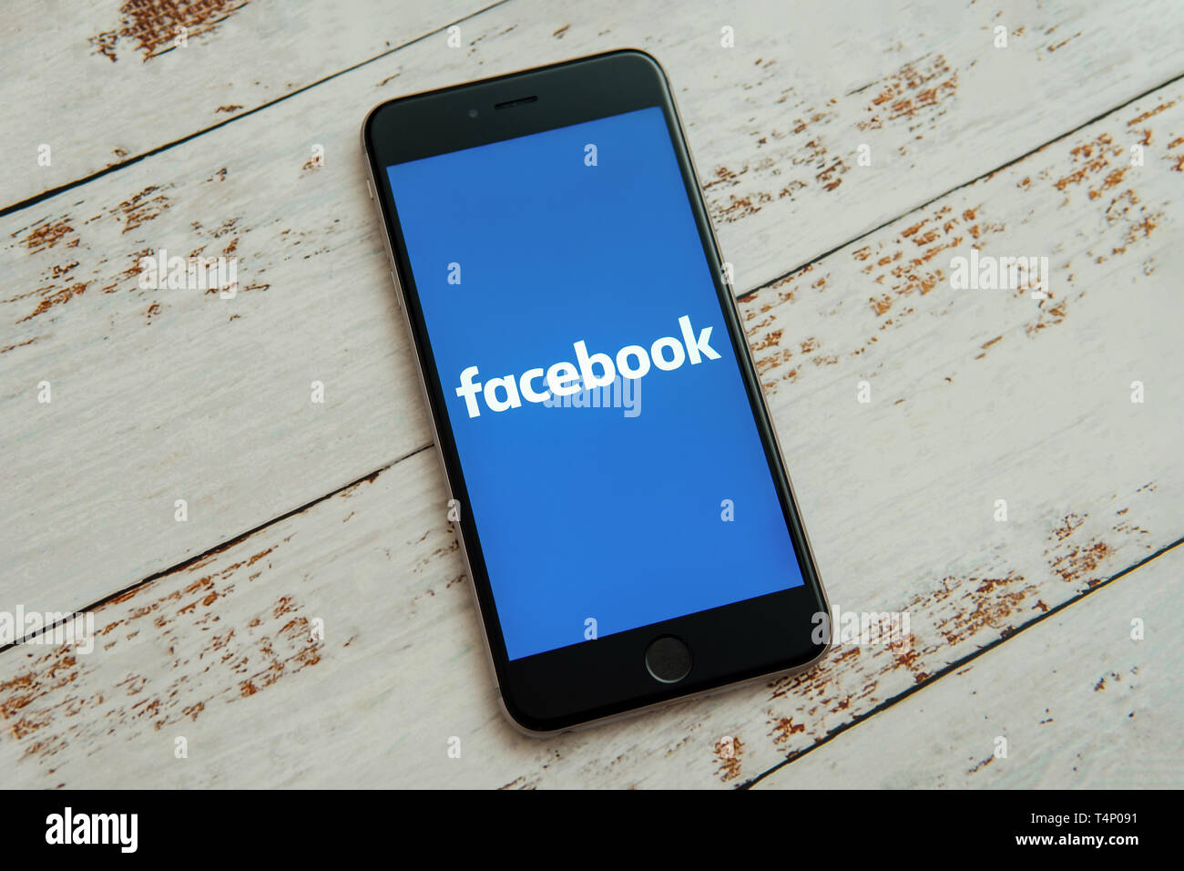 Black iPhone with logo of social media Facebook on the screen. Social ...