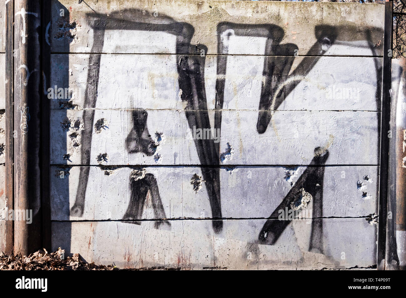 Concrete wall with impact holes Stock Photo - Alamy