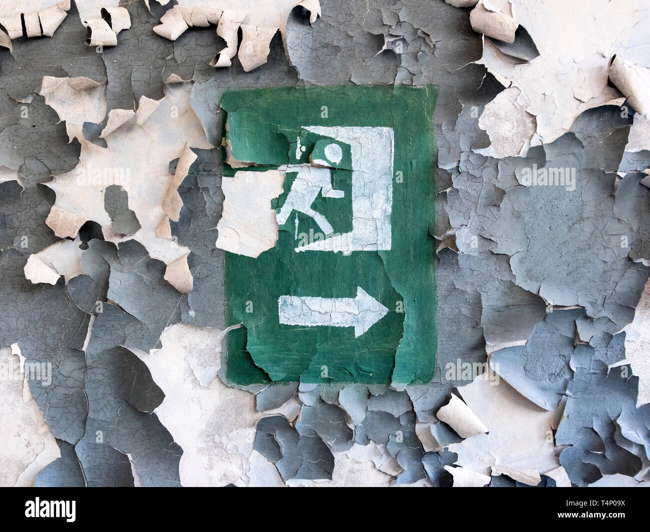 Hand-painted emergency exit sign in an abandoned building Stock Photo ...
