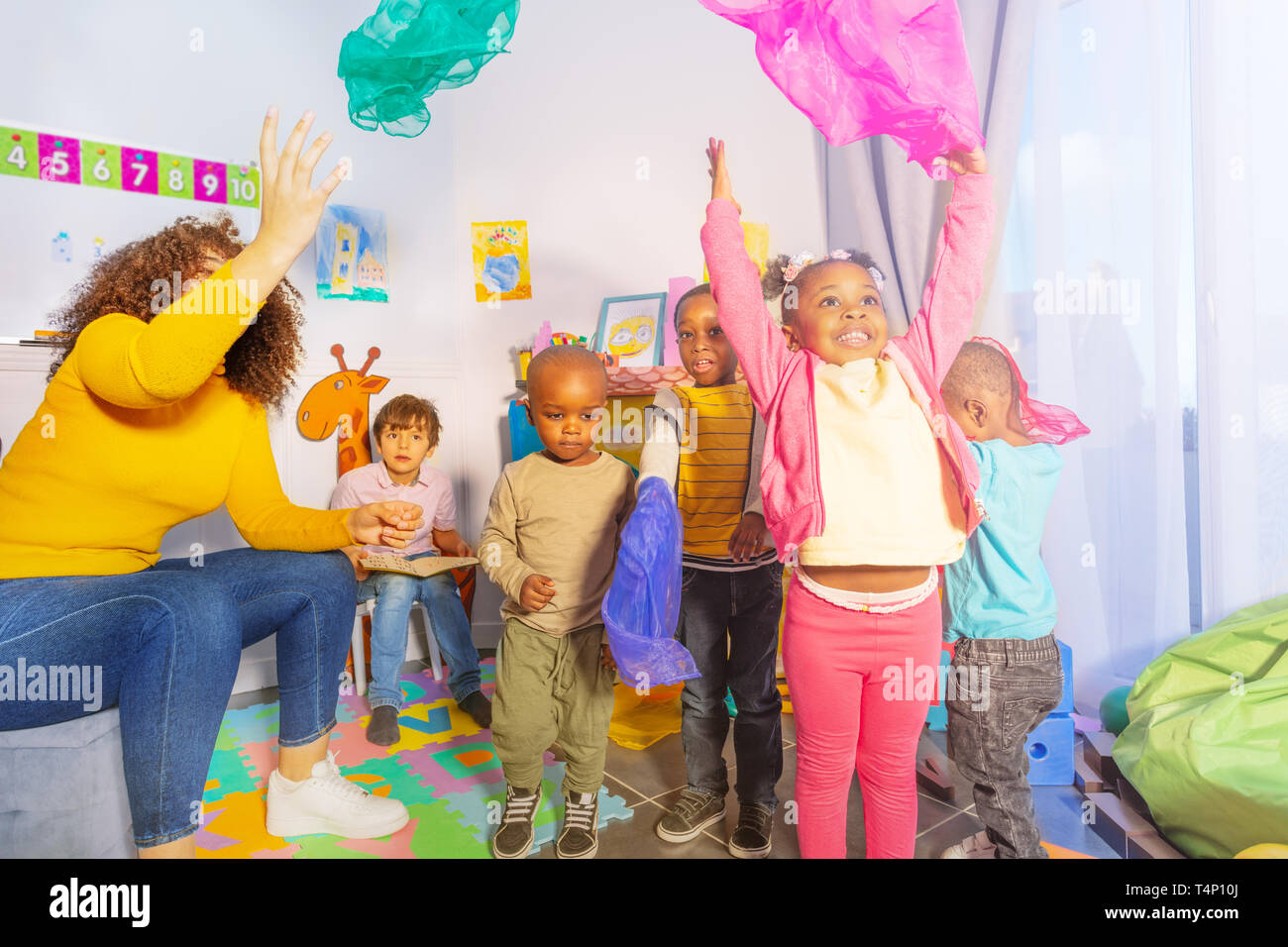 kids play game and throw handkerchief in the air Stock Photo - Alamy