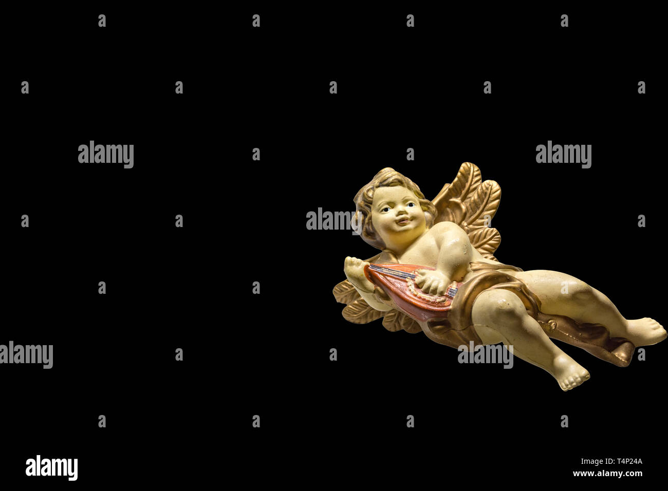 small figurine of lying little angel Stock Photo - Alamy