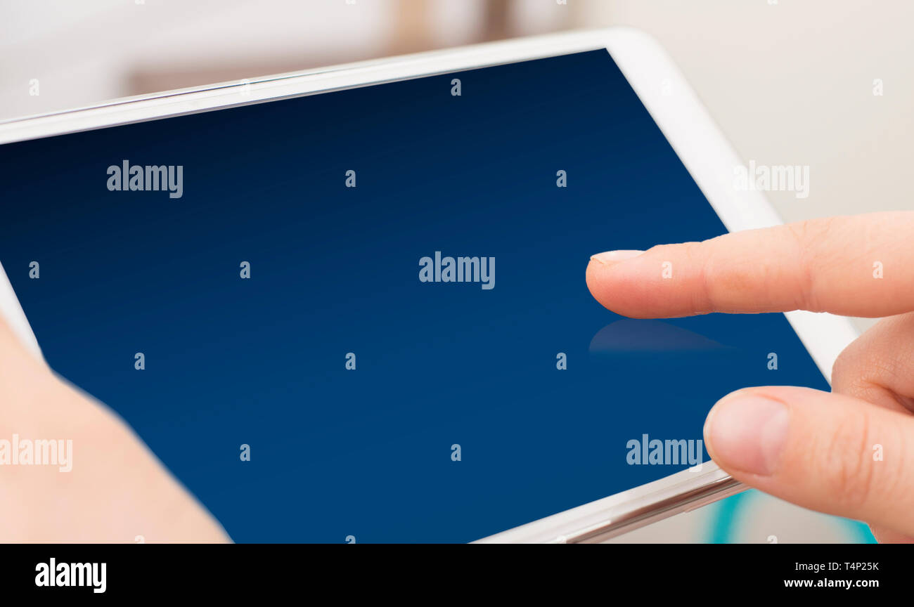 female touch blank blue screen on tablet Stock Photo - Alamy