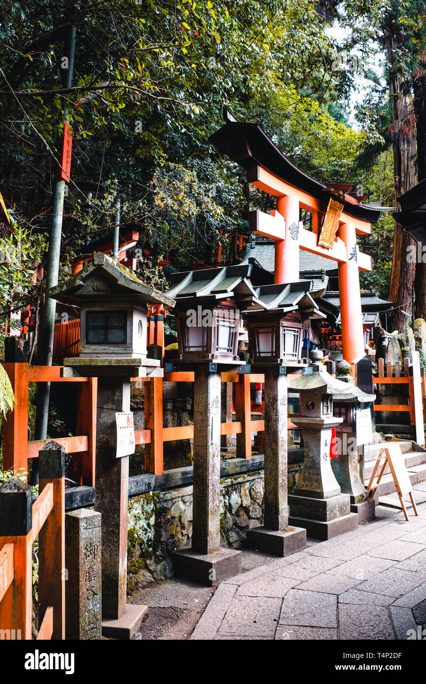 Orange gates and objects at Fushimi Inari-Taisha Shrine in Kyoto, Japan ...