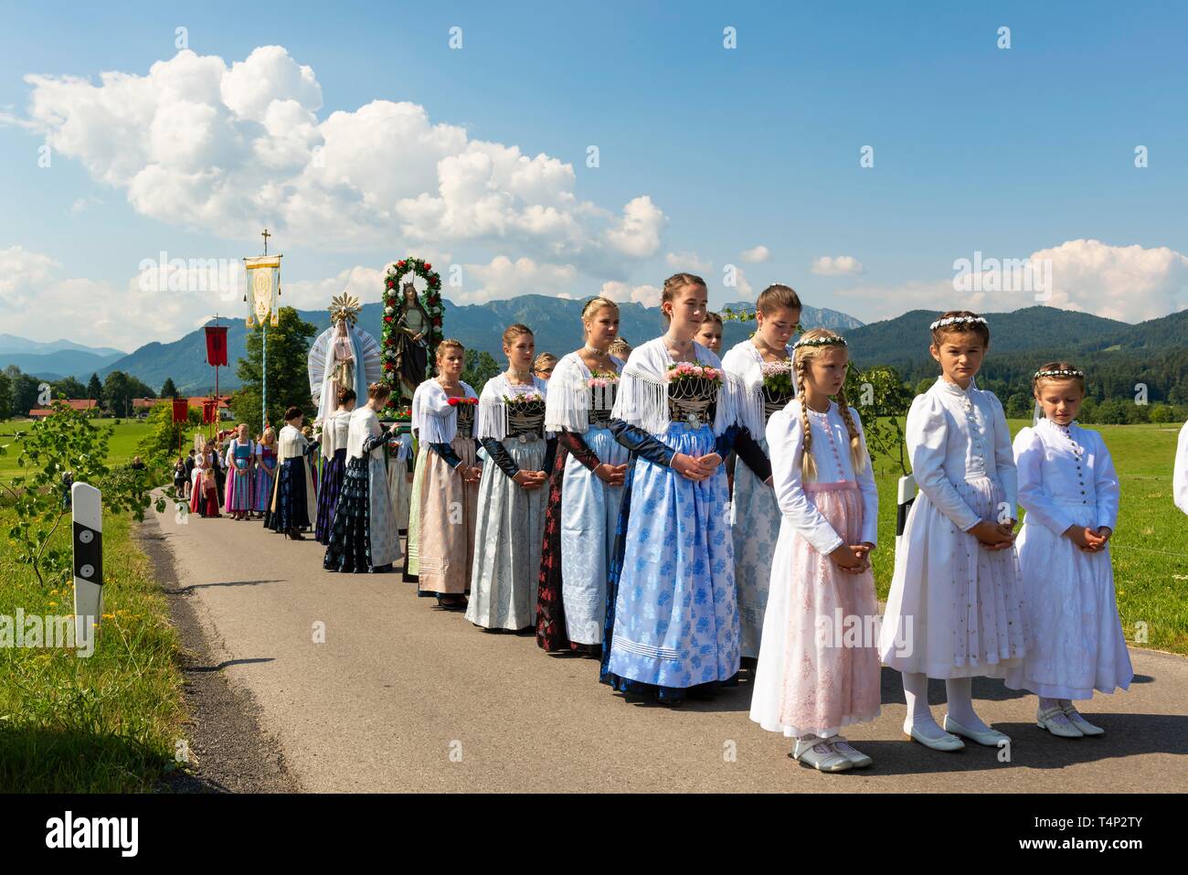 Believers in bavarian traditional costumes hi-res stock photography and ...