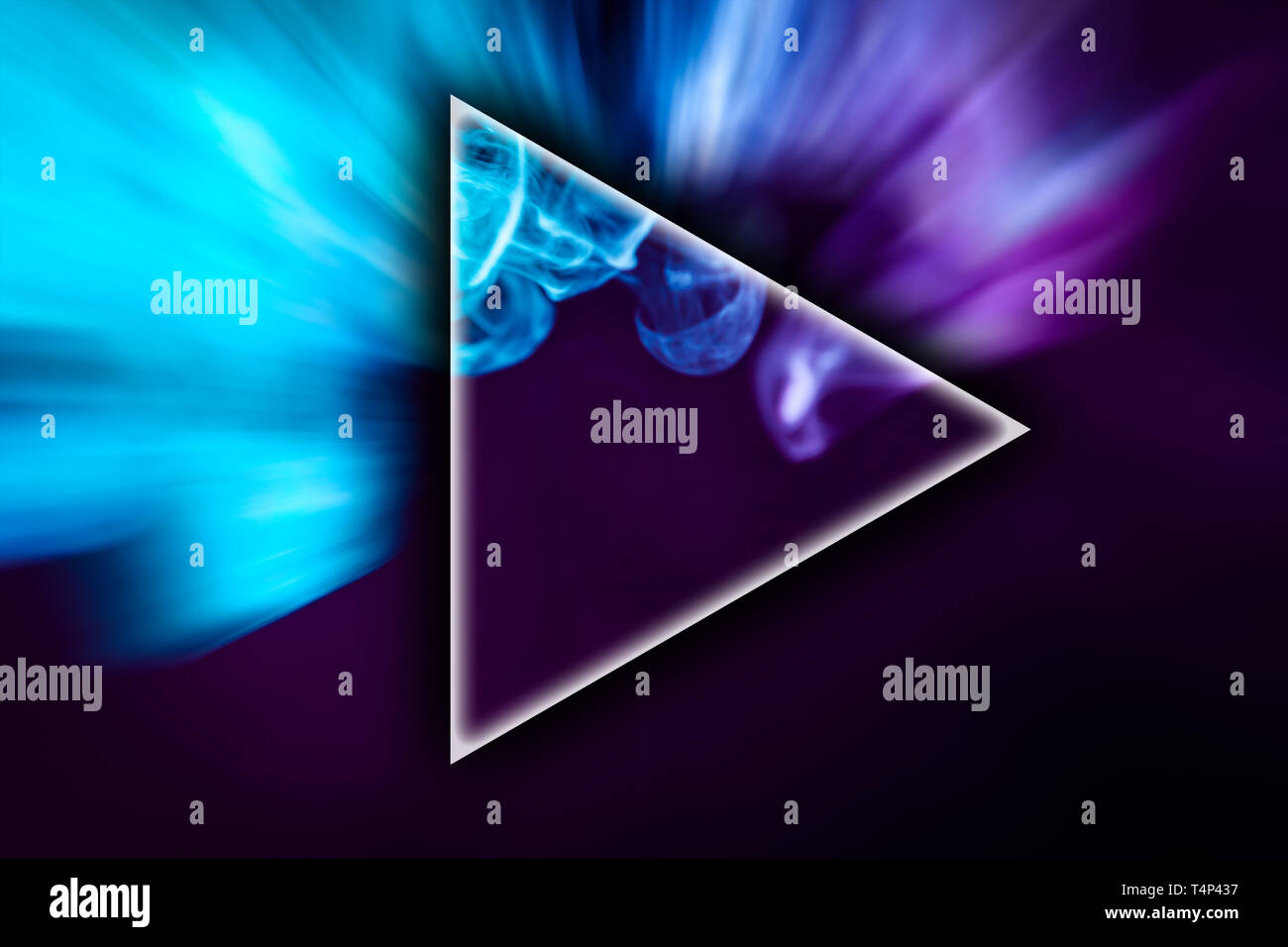 Thick colorful smoke of pink, blue in the shape of a triangle on a ...