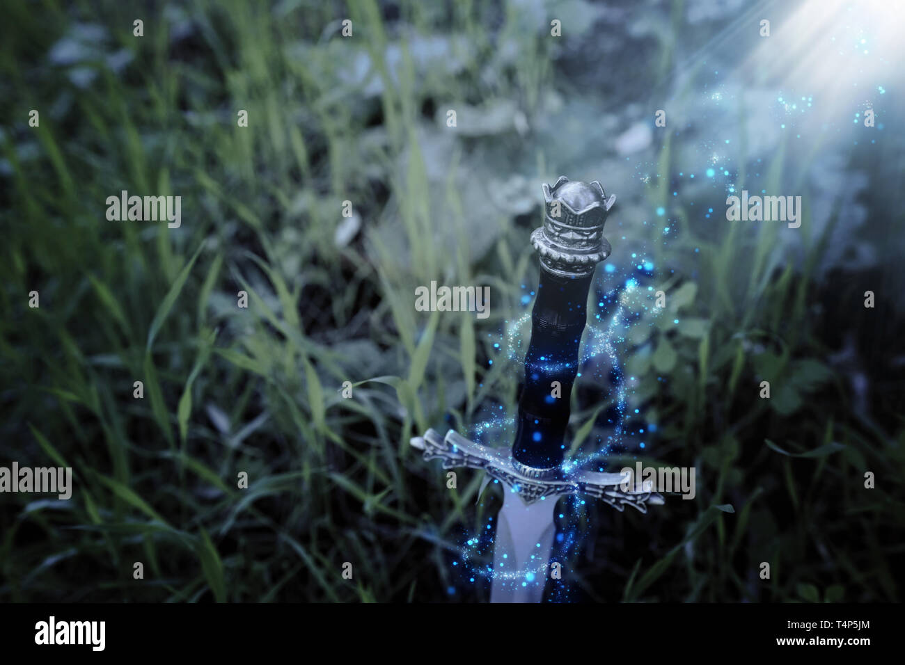 mysterious and magical photo of silver sword over England woods or ...