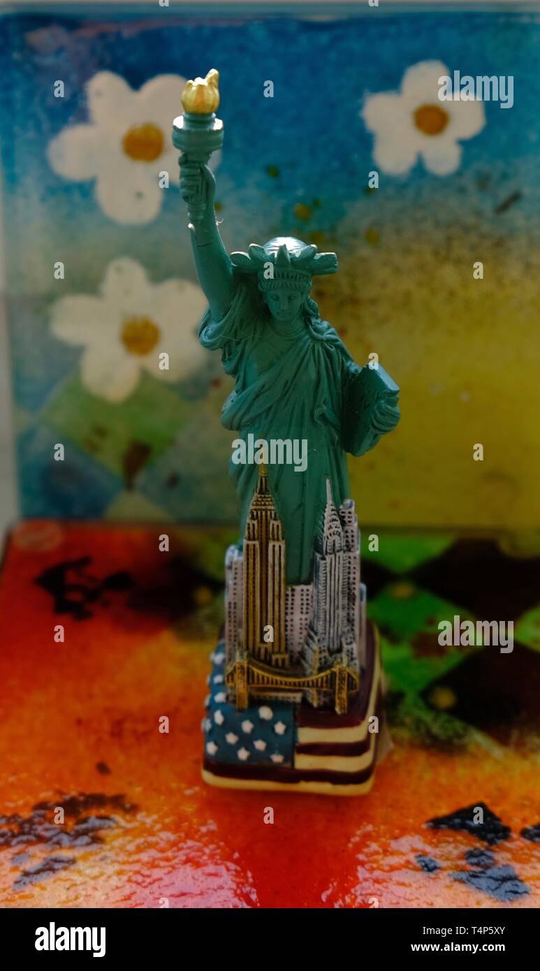 Model of the Statue of Liberty against psychedelic background Stock ...