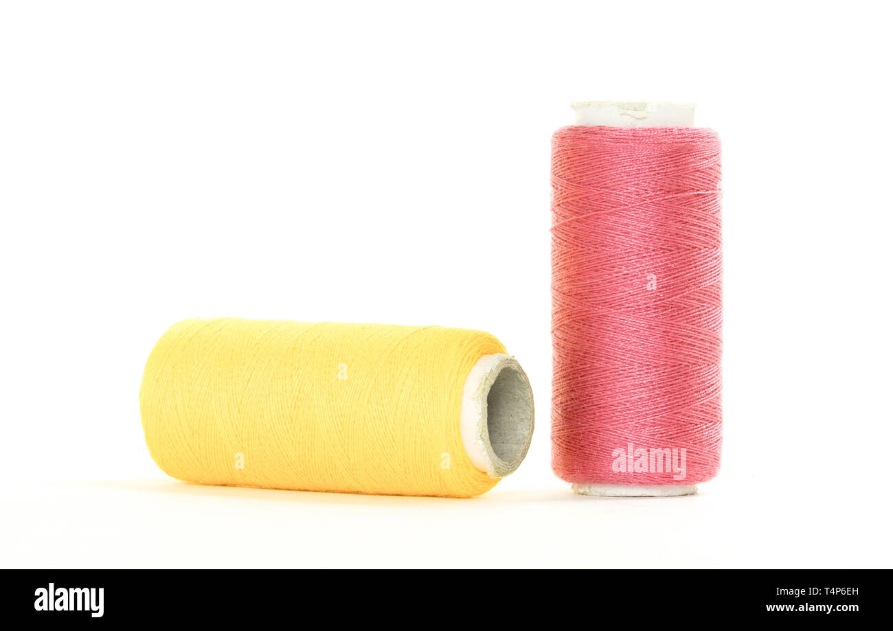 Two sewing thread isolated on a white background Stock Photo - Alamy