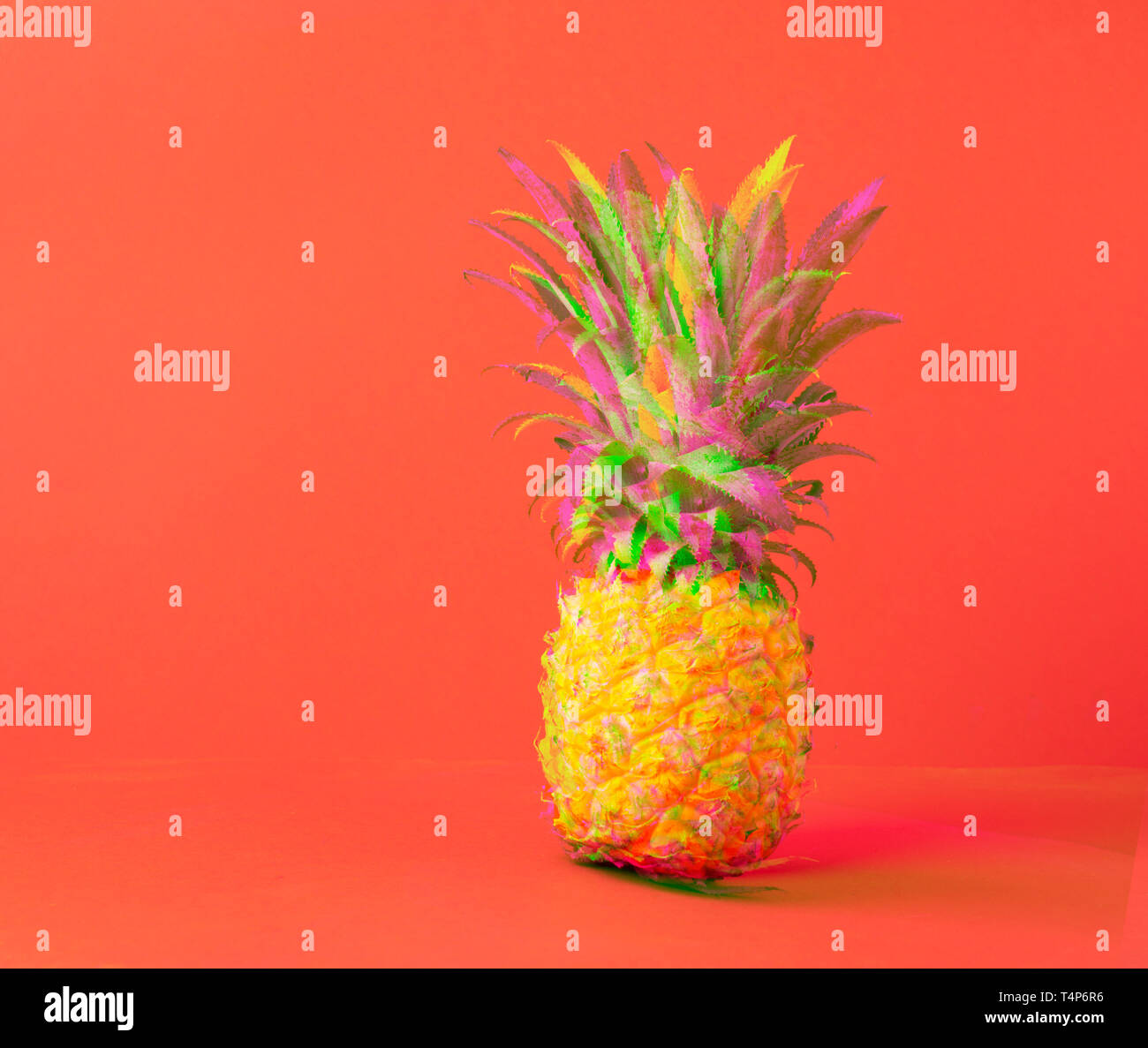 Tropical ripe pineapple a coral background . Summer concept. Glitch ...