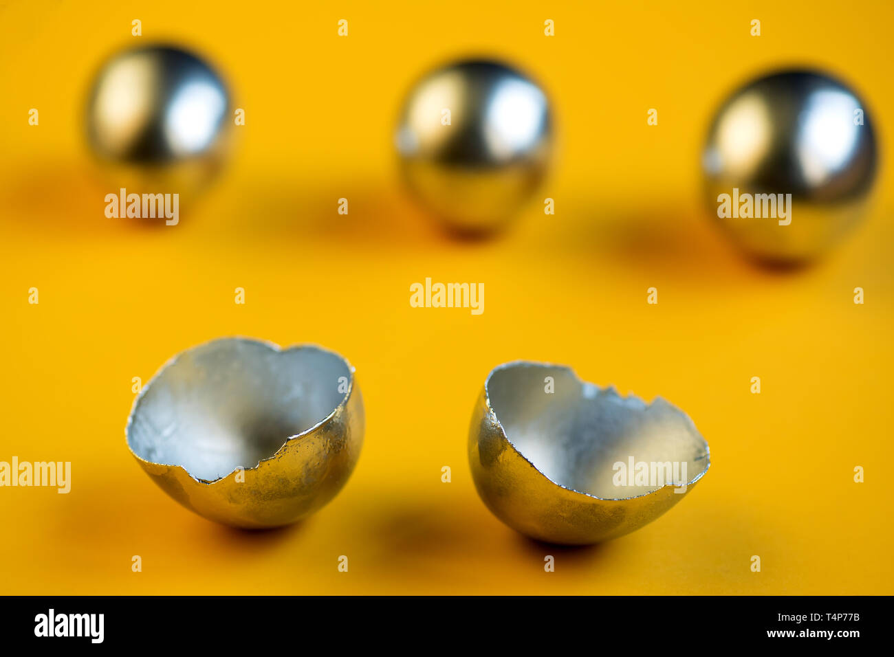 silver eggs and shells on bright colored background Stock Photo - Alamy
