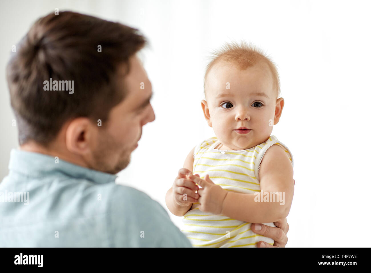 family, fatherhood and people concept - father with little baby ...
