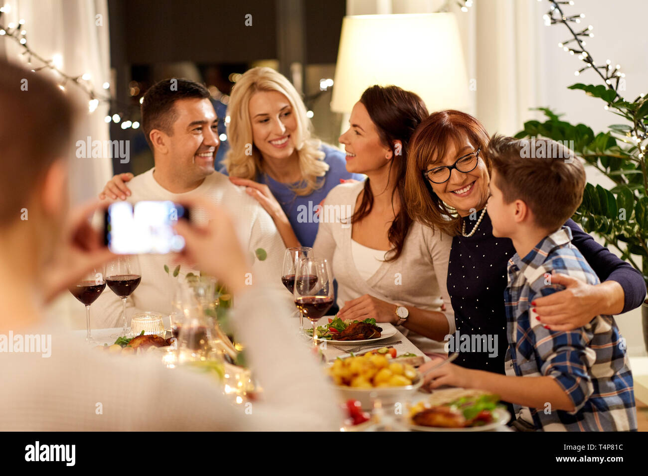 celebration, holidays and people concept - happy family having dinner ...