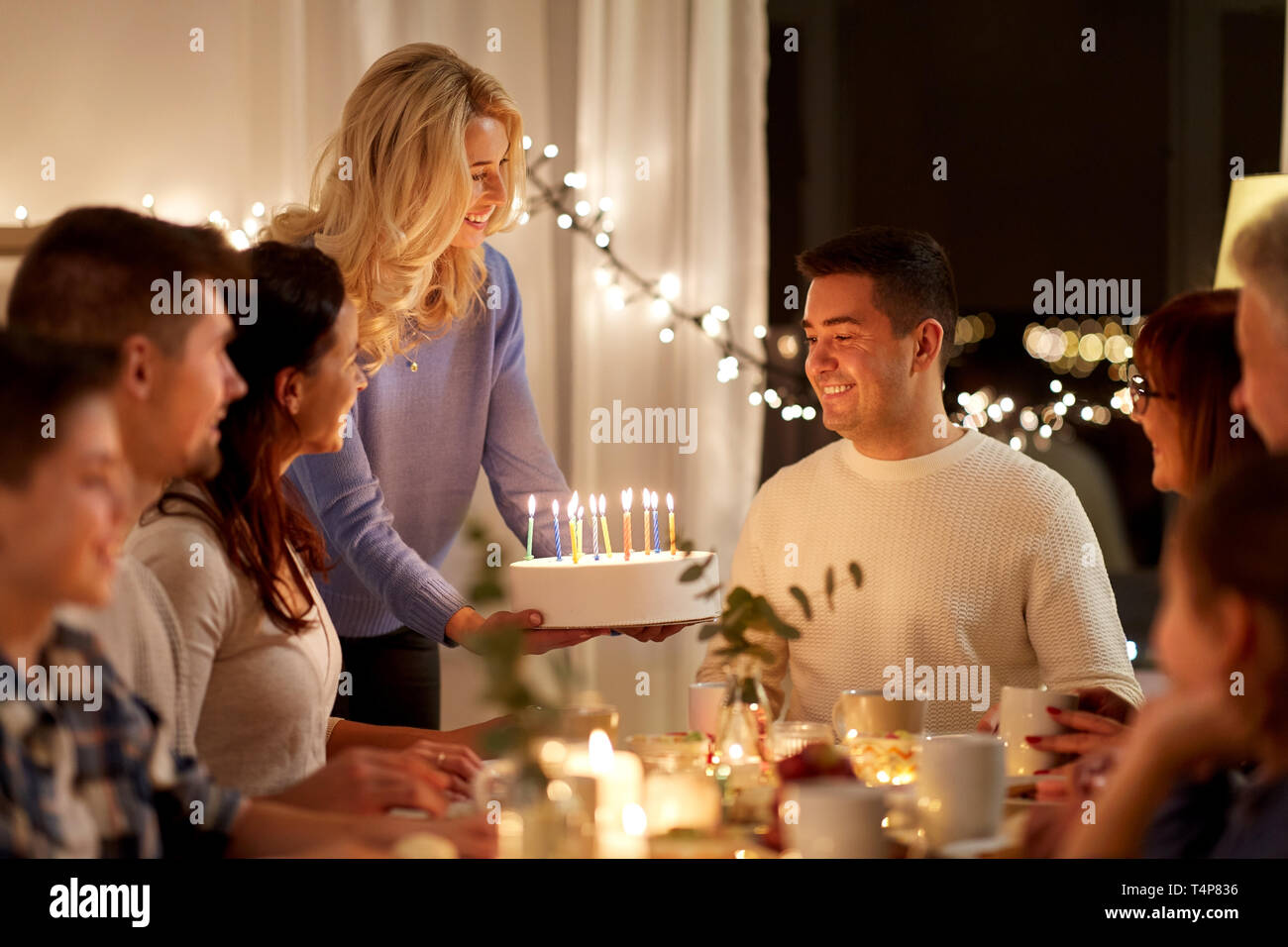 celebration and people concept - happy family with cake having birthday ...