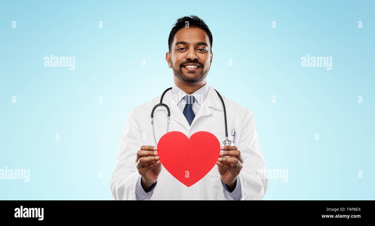 medicine, cardiology and healthcare concept - smiling indian male ...