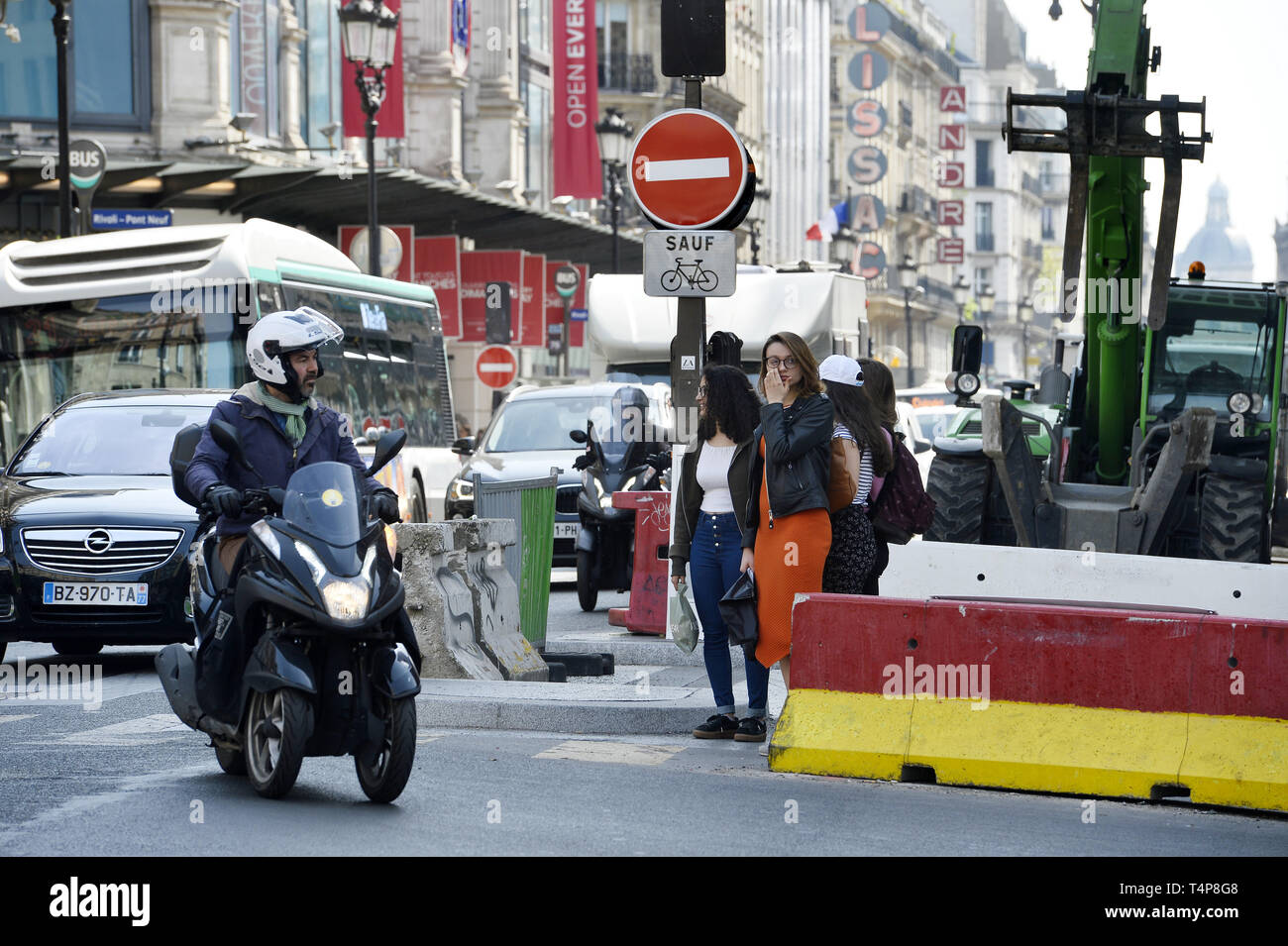 Vehicules and pedestrians struggling against traffic conditions in rue ...