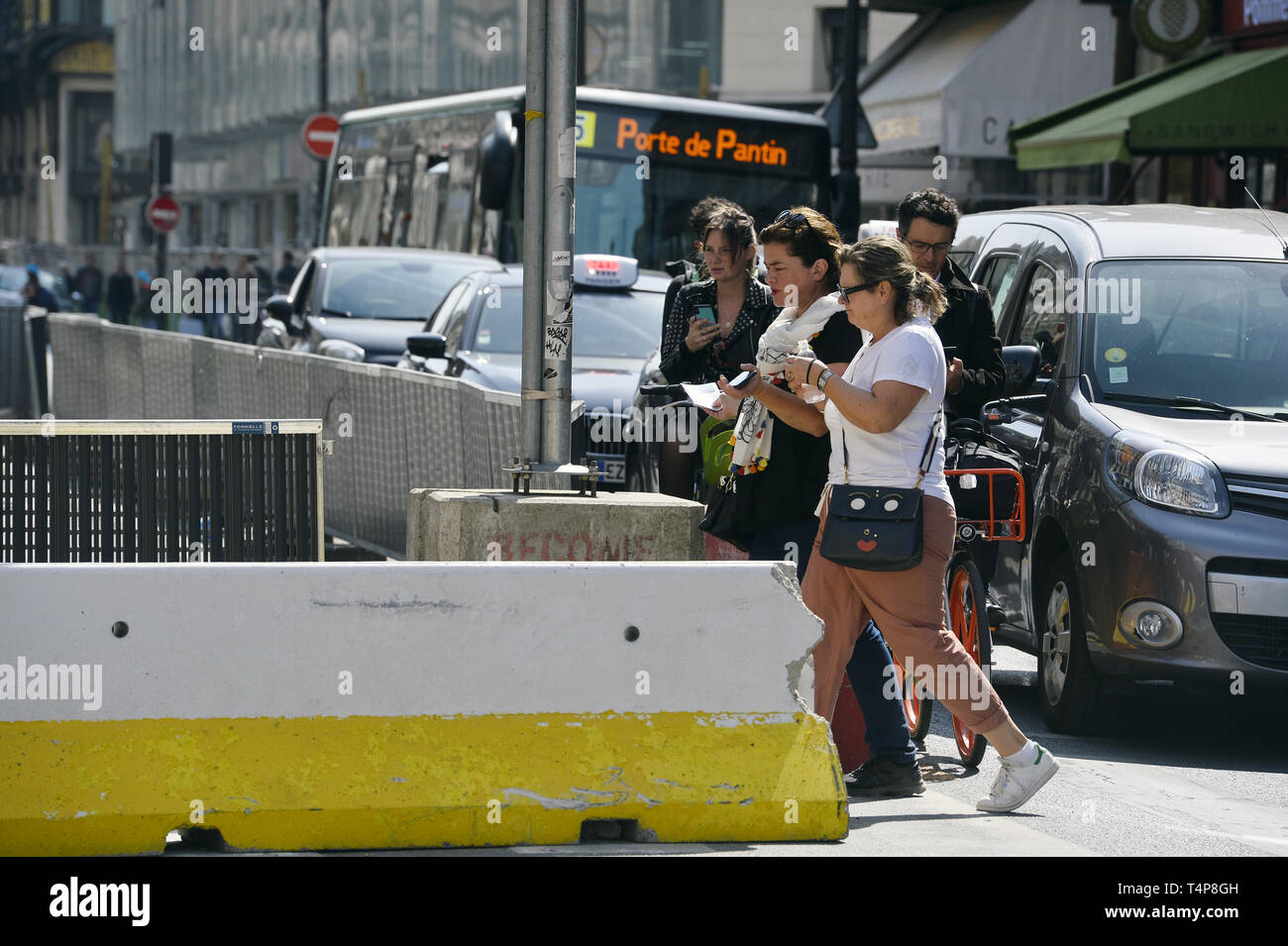 Vehicules and pedestrians struggling against traffic conditions in rue ...