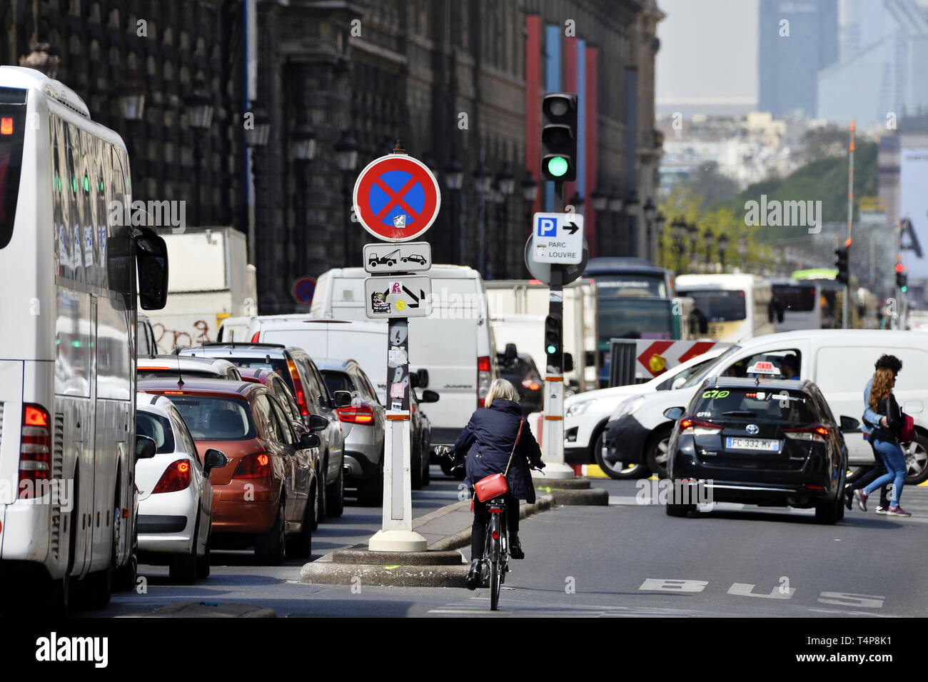 Vehicules and pedestrians struggling against traffic conditions in rue ...
