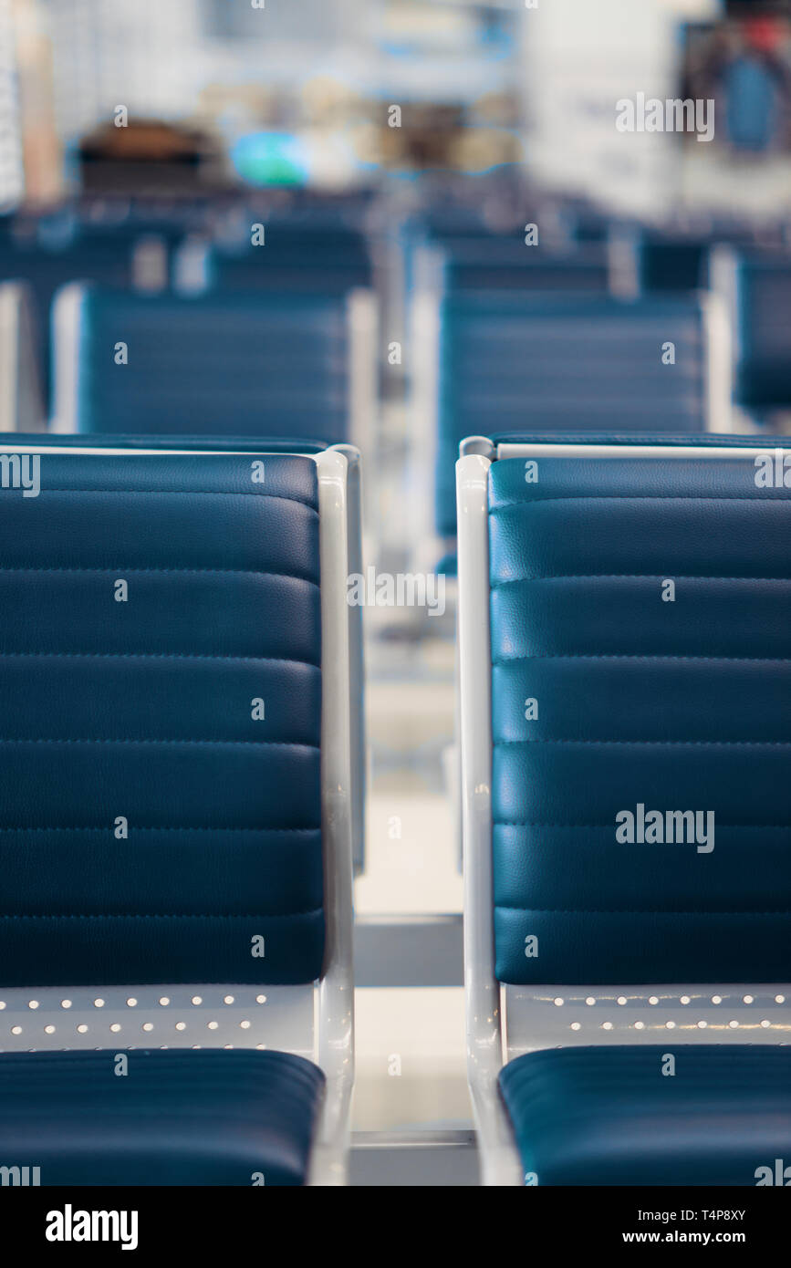 Row of seats in airport waiting zone, nobody. Departure area of air ...