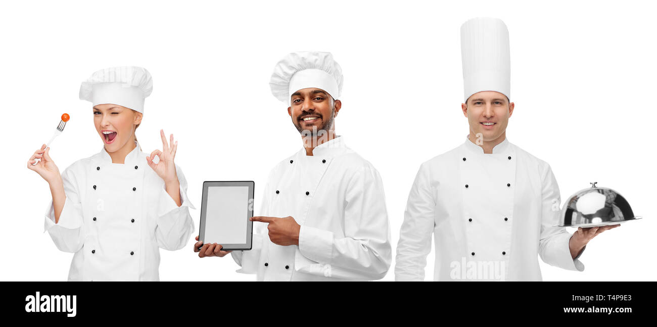 cooking, technology and people concept - happy chefs with tablet ...
