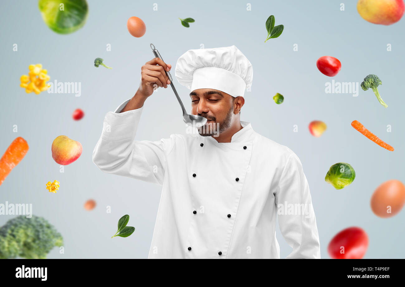cooking, profession and healthy eating concept - happy male indian chef ...