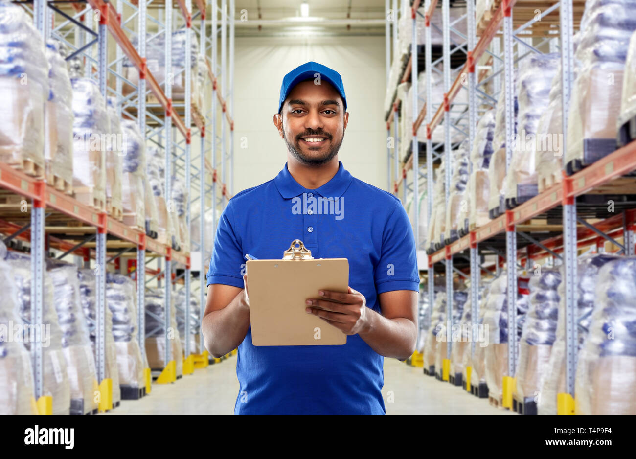 mail service and shipment concept - happy indian delivery man or ...