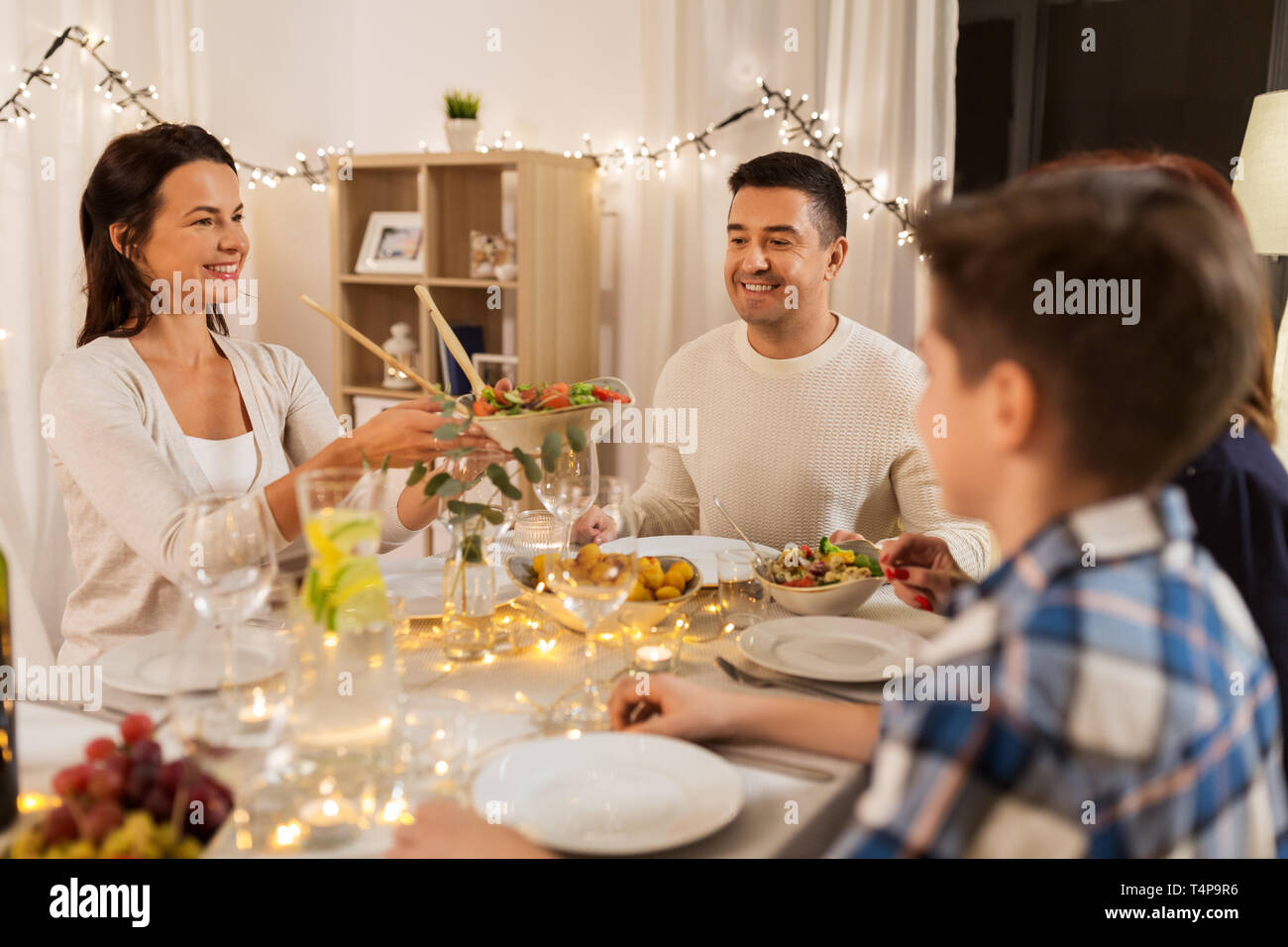 celebration, holidays and people concept - happy family having dinner party at home Stock Photo ...