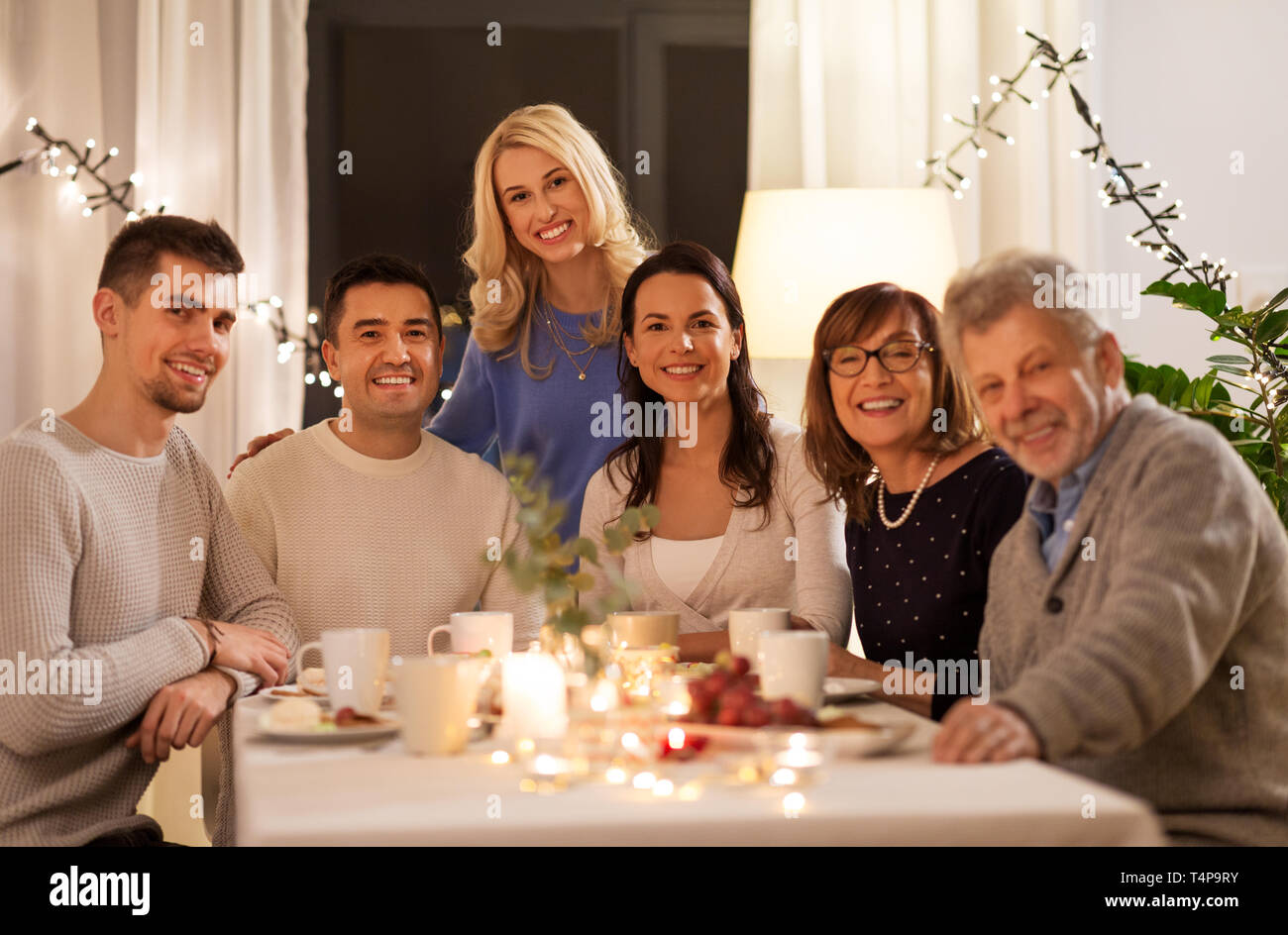 celebration, holidays and people concept - happy family having tea ...