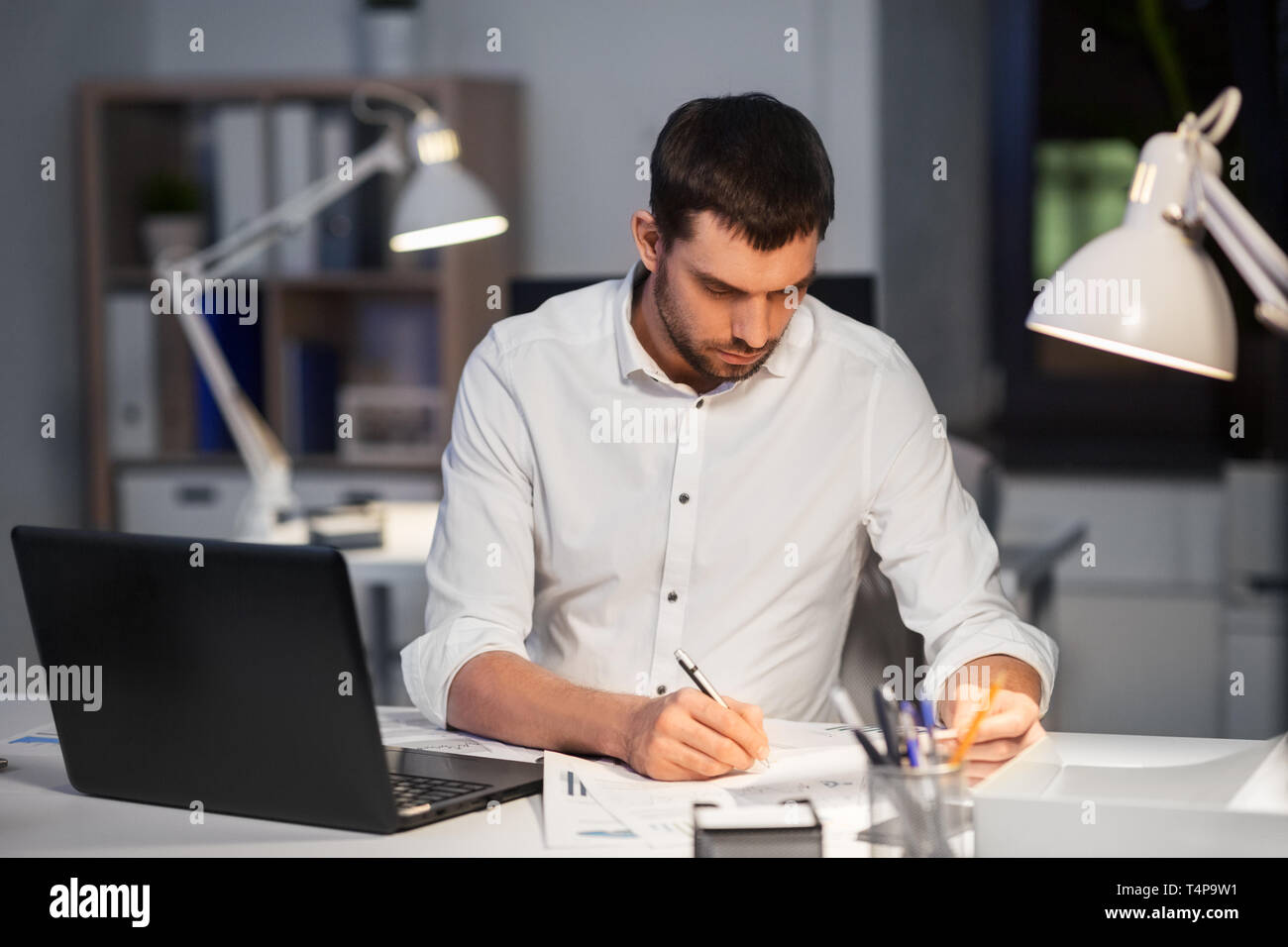 business, deadline and people concept - businessman with laptop ...
