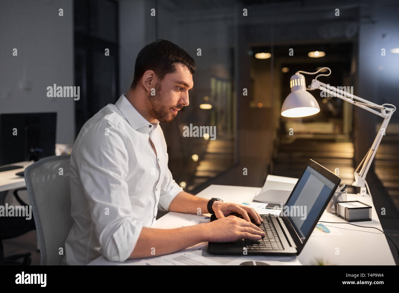 business, deadline and people concept - businessman with laptop ...