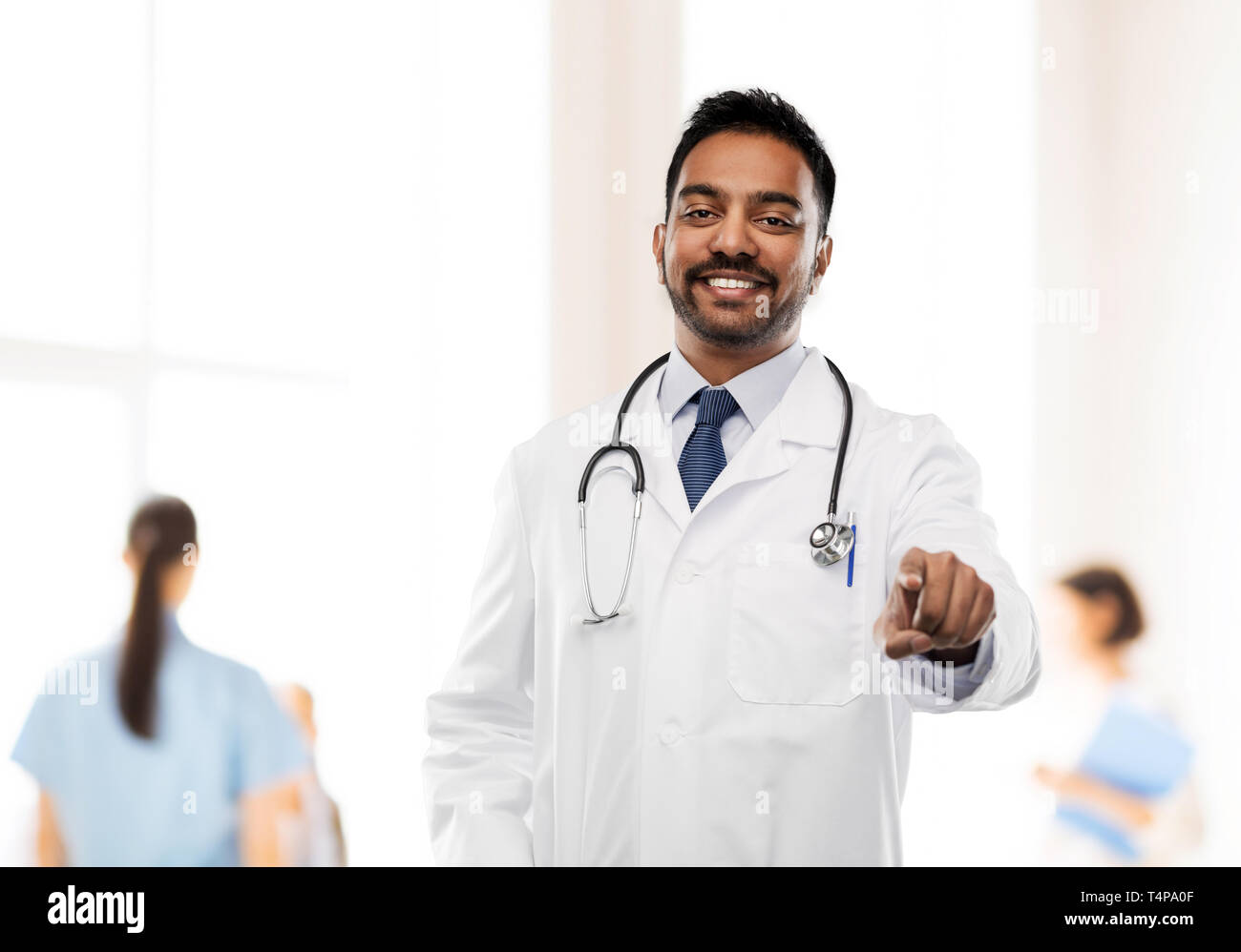 medicine, profession and healthcare concept - smiling indian male ...