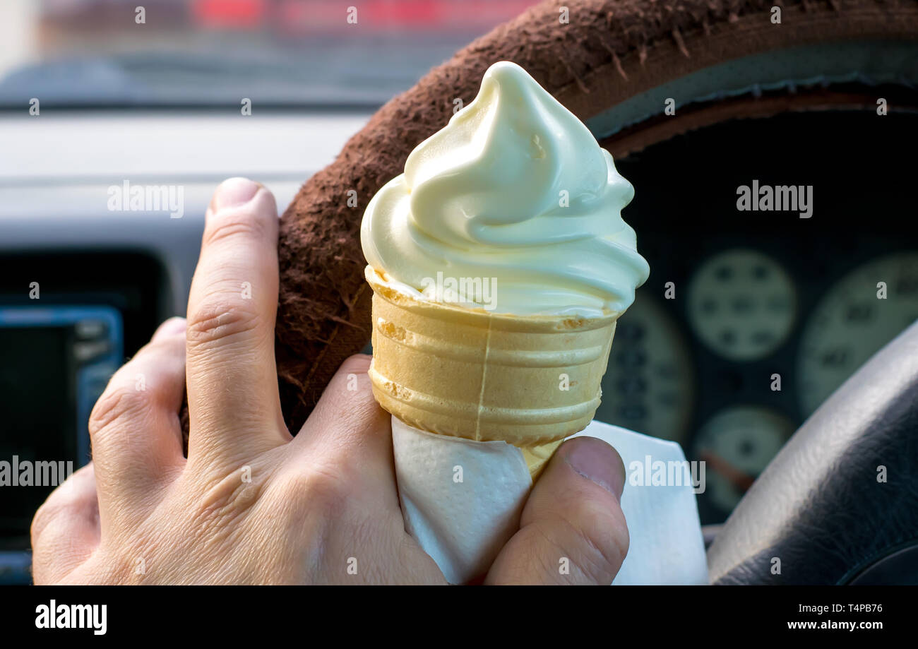 ice cream behind the wheel of a car Stock Photo - Alamy