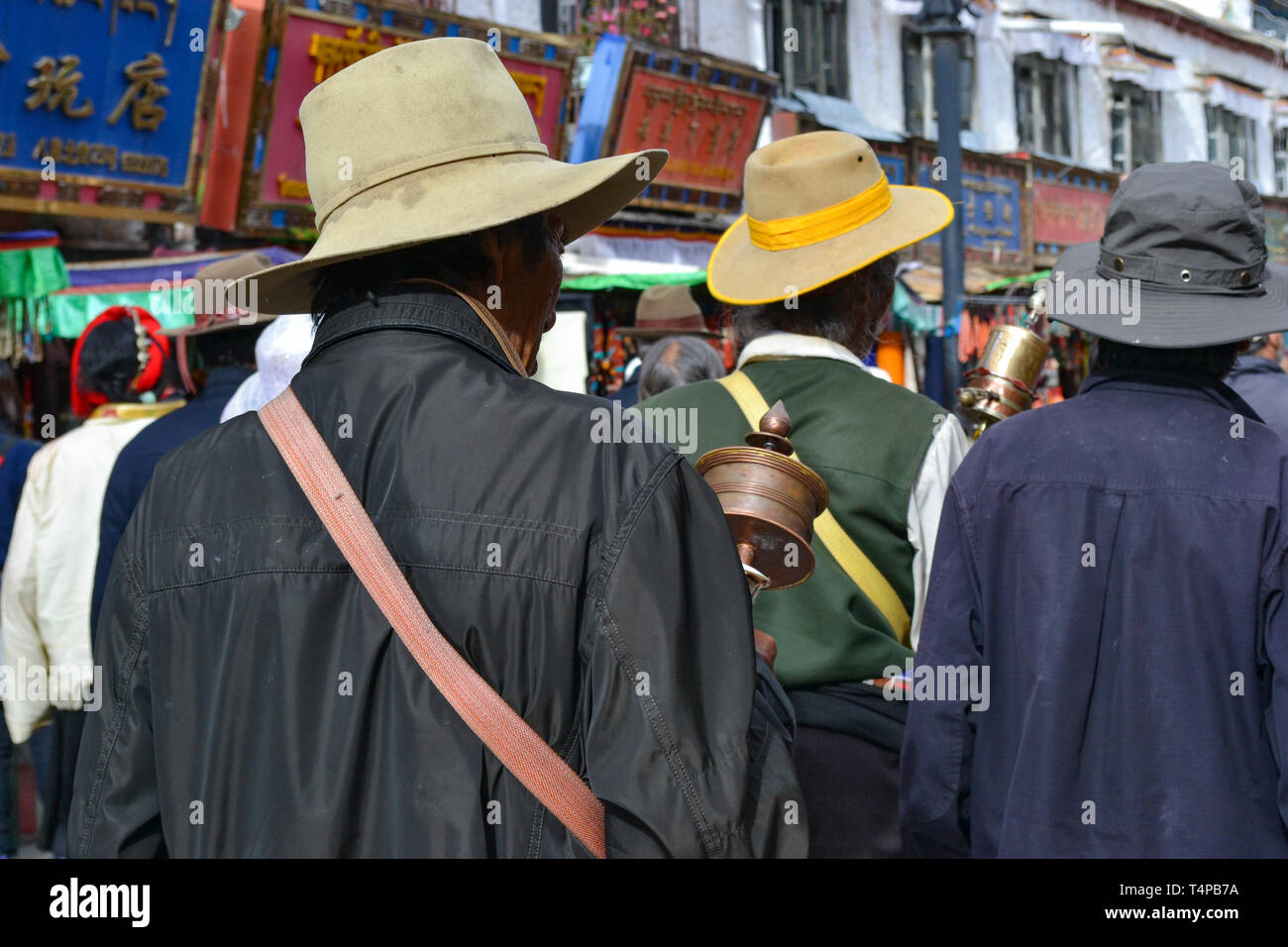 Pilgrims of Tibetan Buddhism, monks, locals, and tourists walking ...