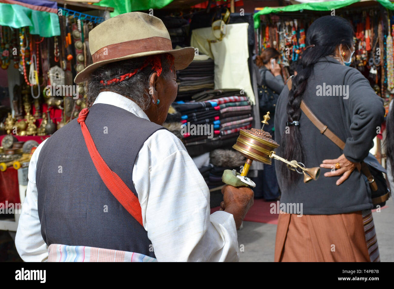 Pilgrims of Tibetan Buddhism, monks, locals, and tourists walking ...