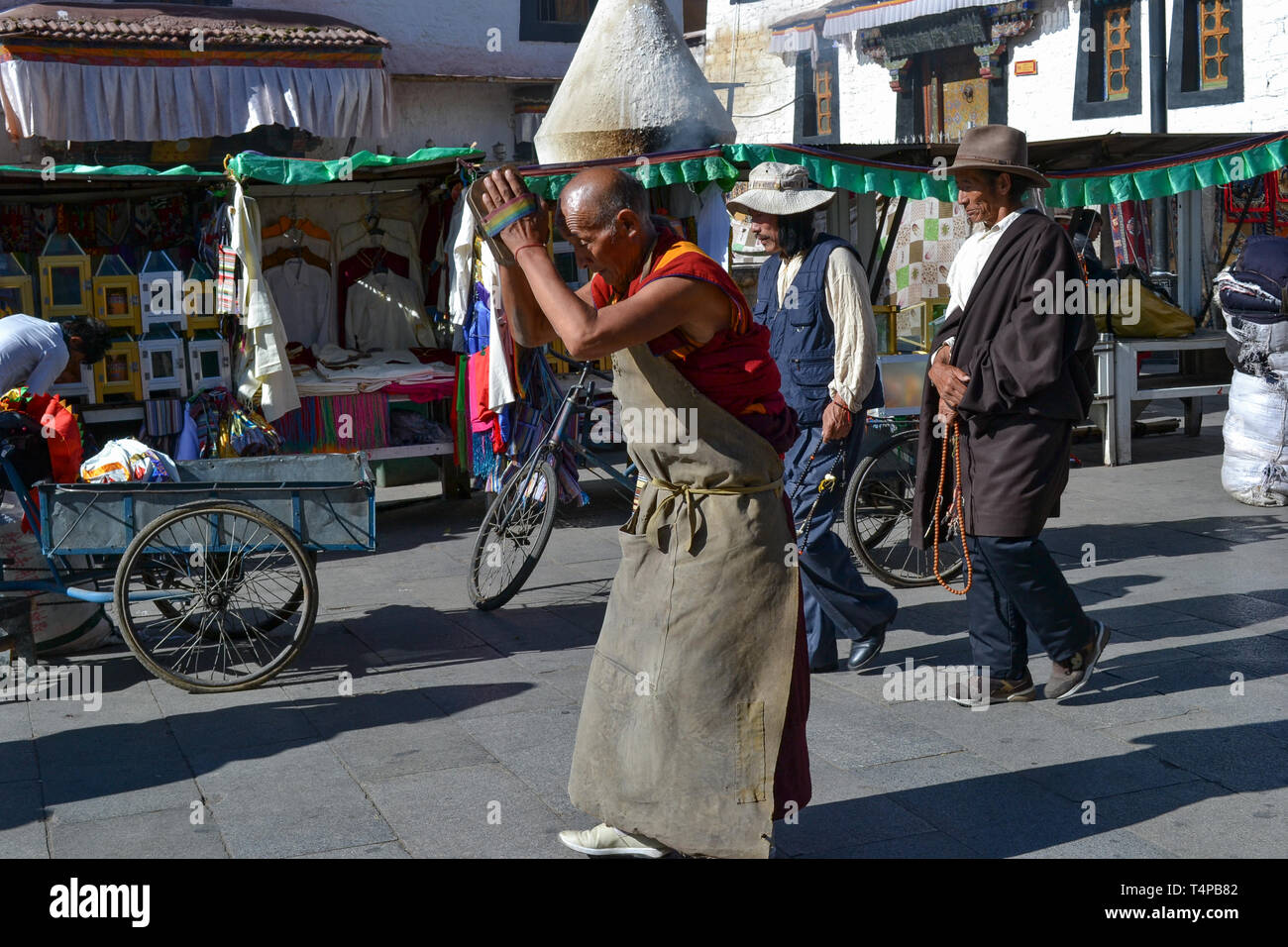 Pilgrims of Tibetan Buddhism, monks, locals, and tourists walking ...