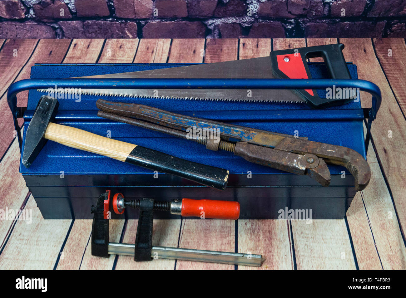 Different Tools like hammer,screw driver and spirit level on a tool box ...