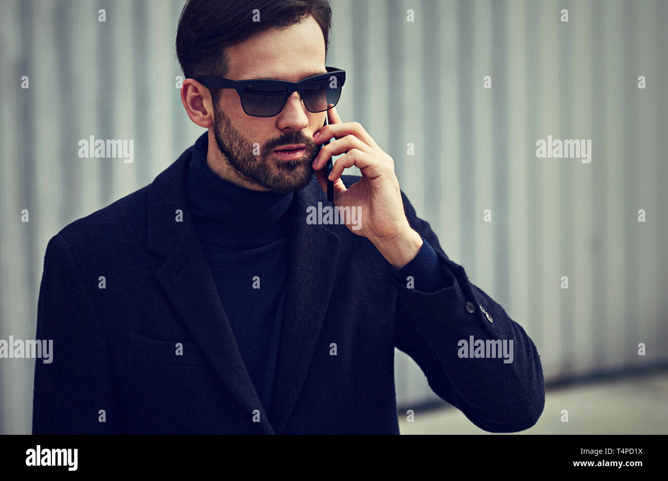 Fashion beard style business handsome male model in fashion sunglasses ...