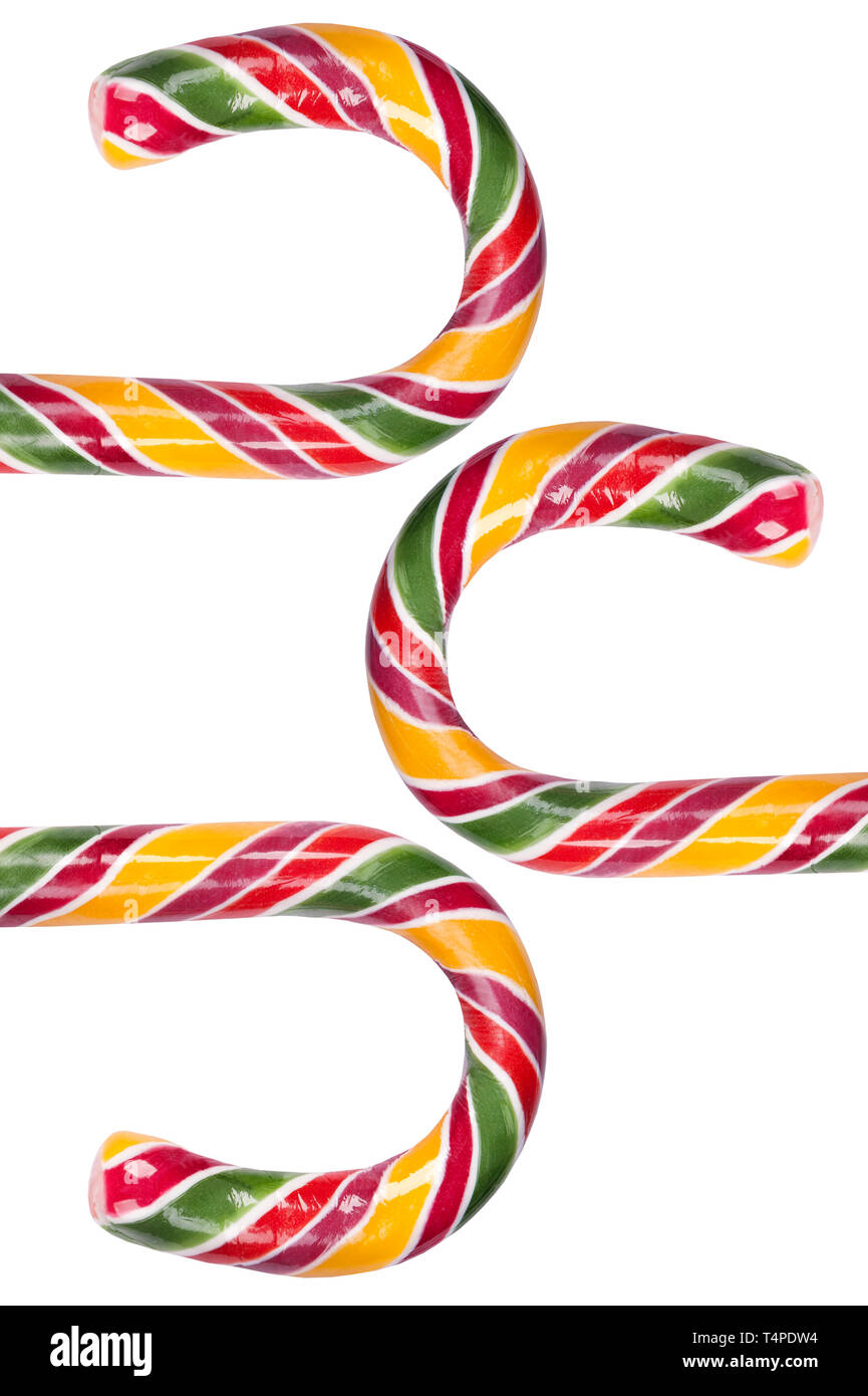 three candy canes on white background Stock Photo - Alamy