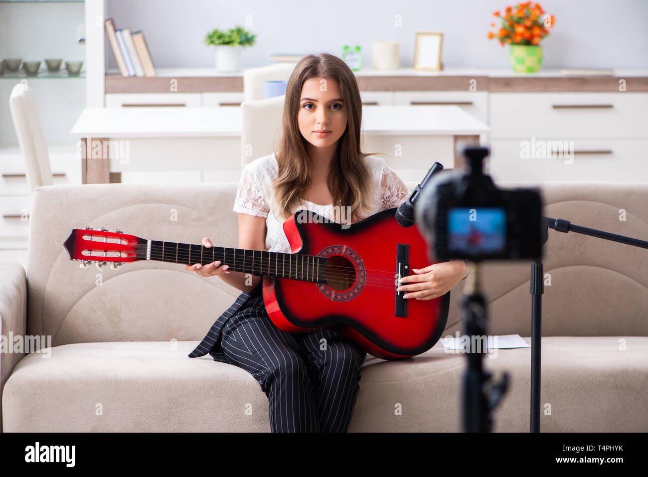 Female singer playing guitar recording hi-res stock photography and ...