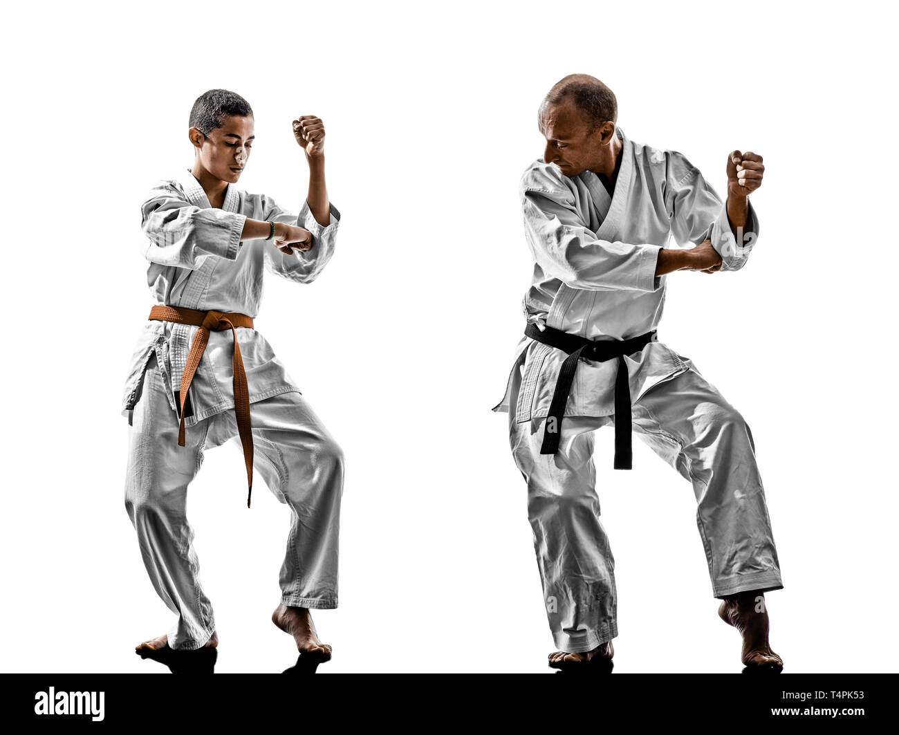 two karate men sensei and teenager student teacher teaching isolated on ...
