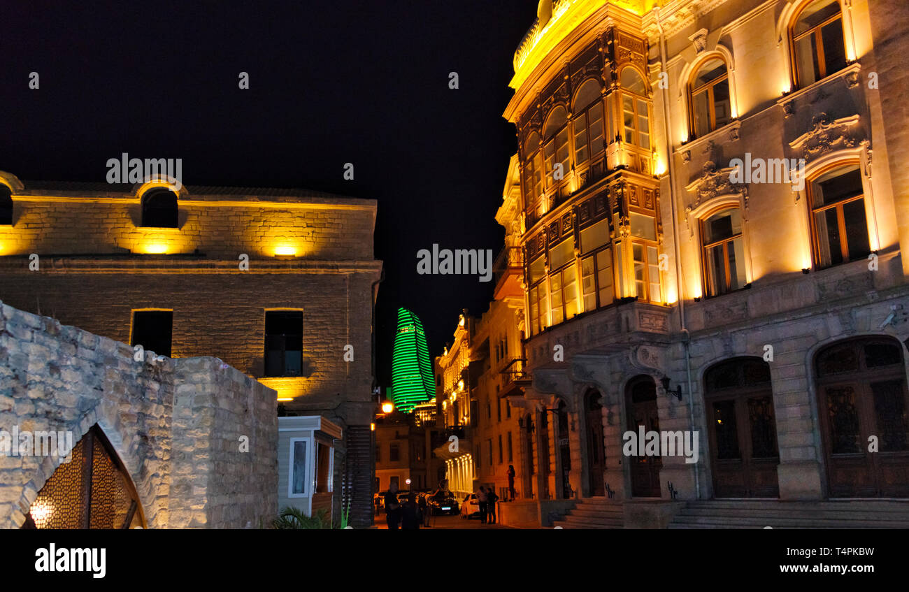Night view of old houses in the Inner City of Baku, Flaming Towers in ...