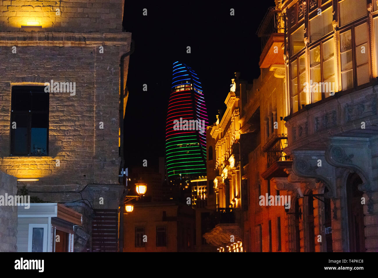 Night view of old houses in the Inner City of Baku, Flaming Towers in ...