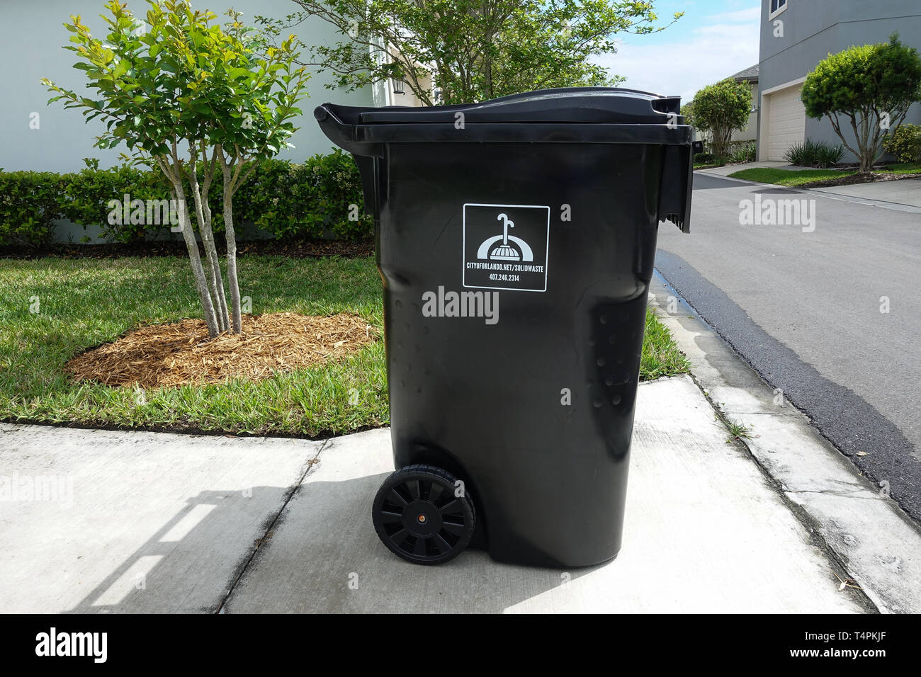 Orlando, FL/United States - 03/20/19: Full garbage bin waiting for the ...