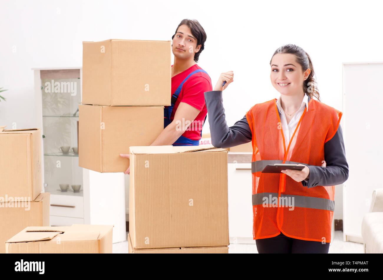 Professional movers doing home relocation Stock Photo - Alamy