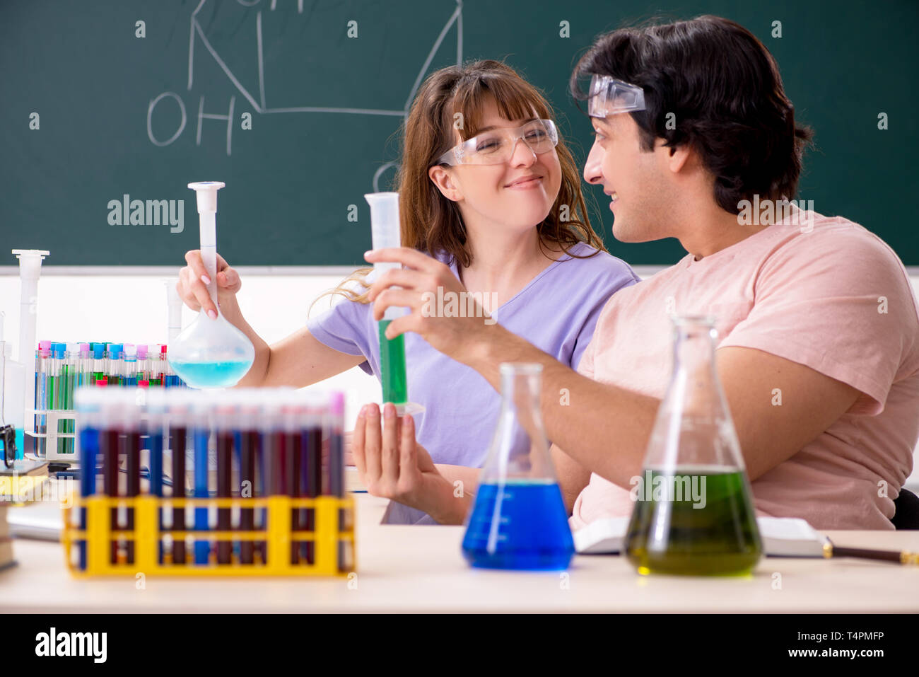 Two chemists students in classroom Stock Photo - Alamy